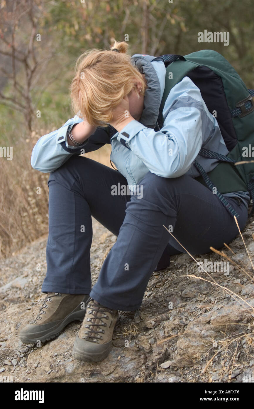 Woman resting after walking Stock Photo - Alamy