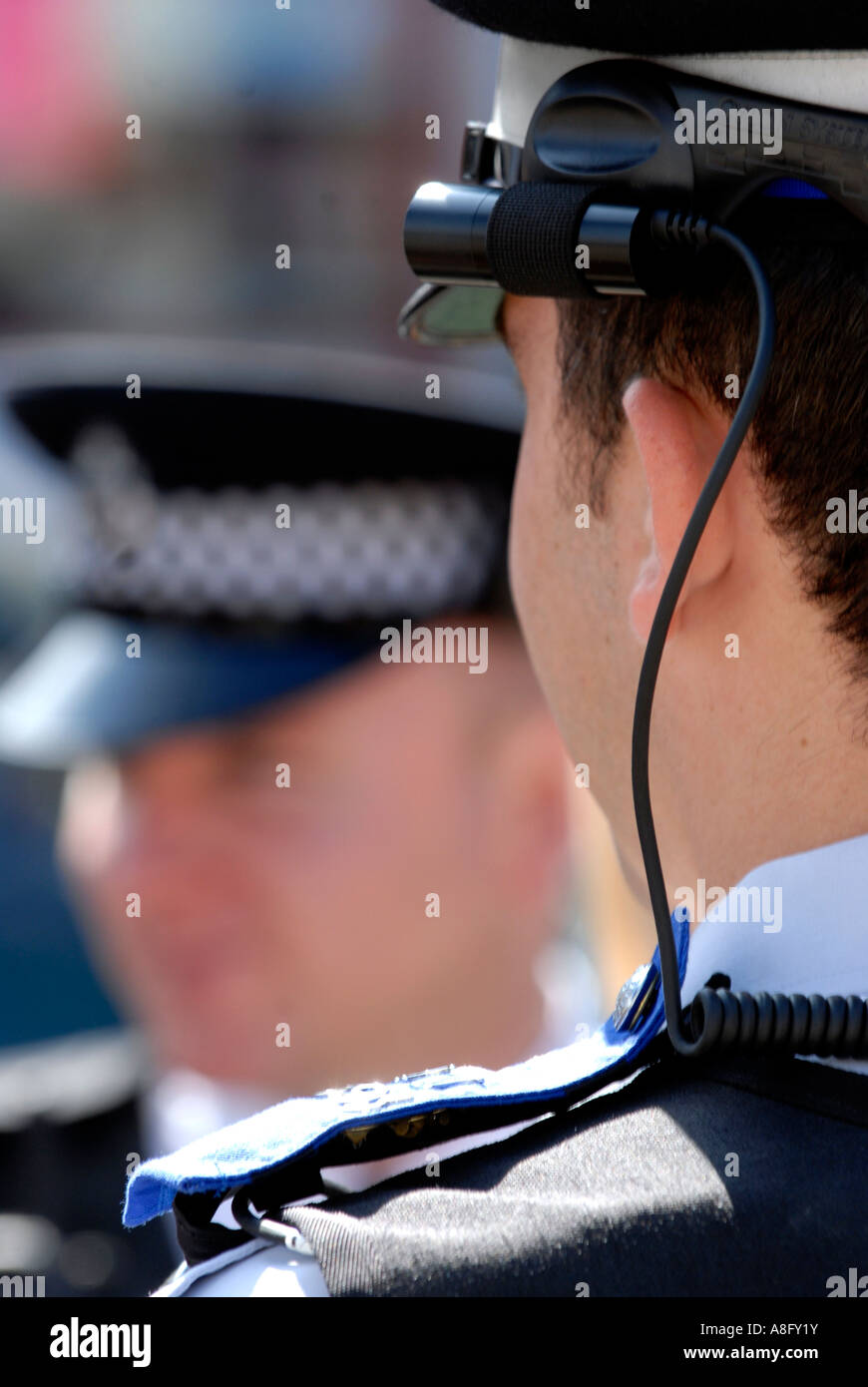 Metropolitan police officers with cctv cameras attached to their hats ...