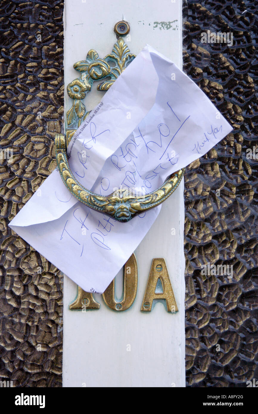 letter or message left on front door Stock Photo - Alamy