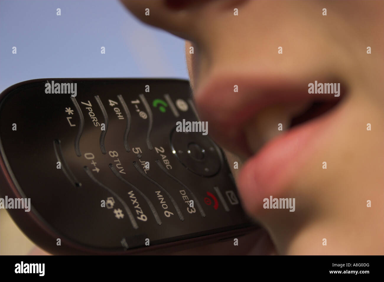 Communicating on a mobile phone Stock Photo - Alamy