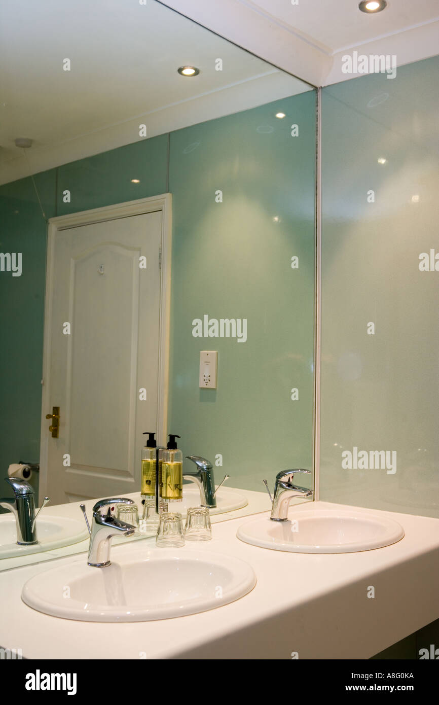 Double sink unit in bathroom Stock Photo - Alamy