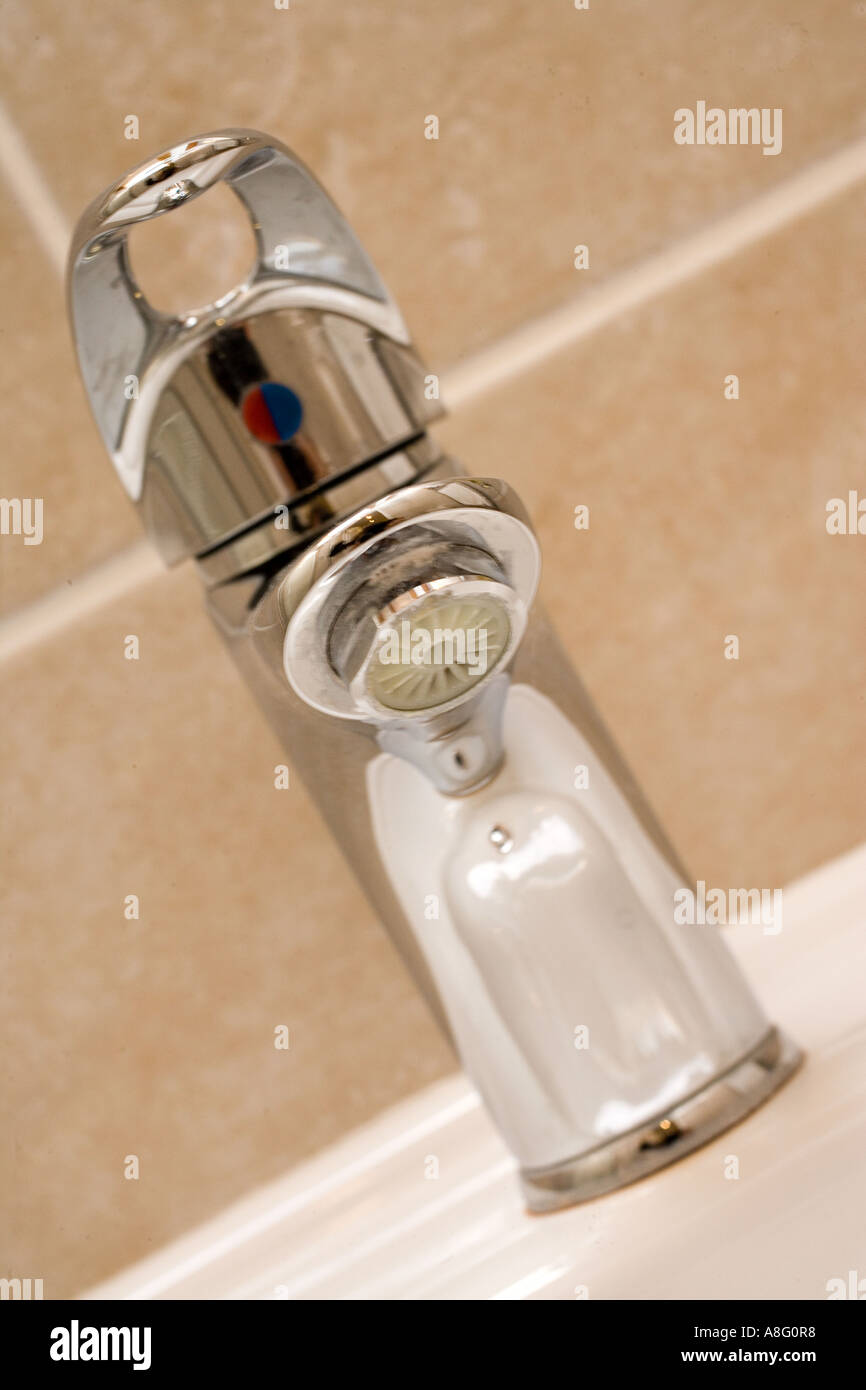 Sink tap white chrome shiny metallic hand bathroom hi-res stock ...