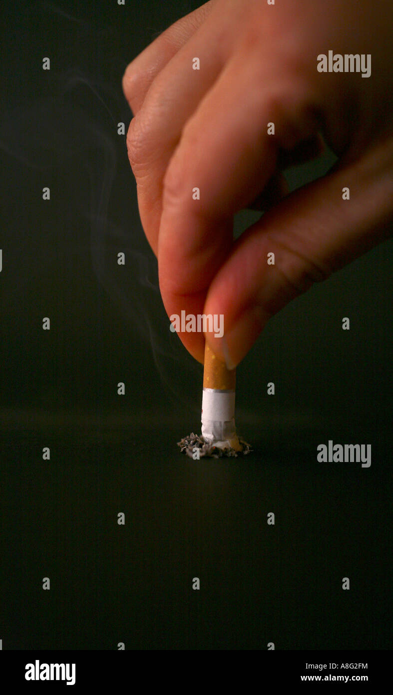 Stubbing out cigarette hi-res stock photography and images - Alamy