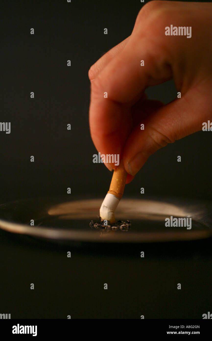 Stubbing out cigarette hi-res stock photography and images - Alamy