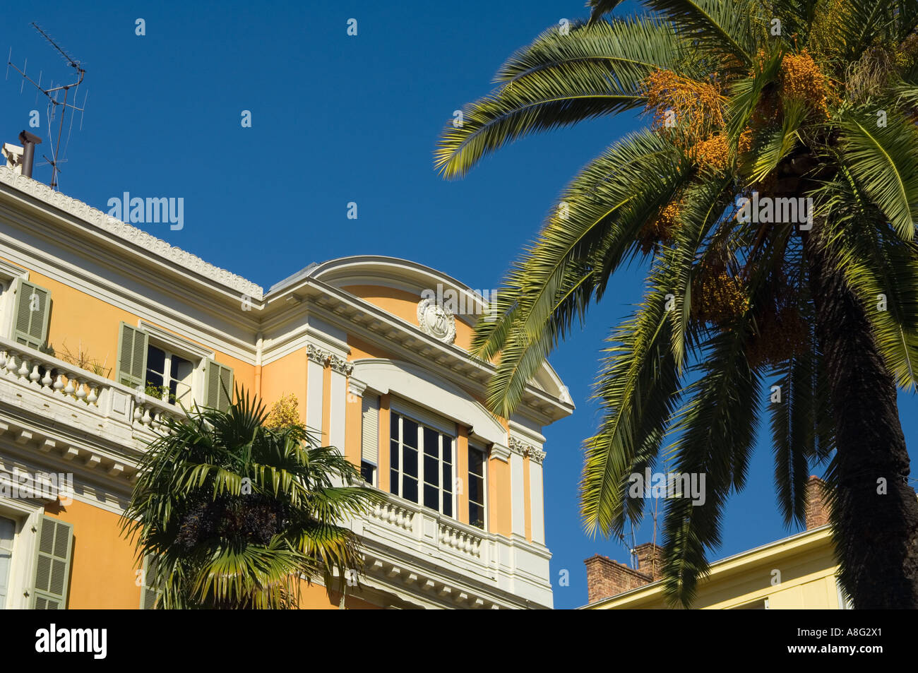 A scene common in Nice (France), a Belle Epoque style building, blue ...