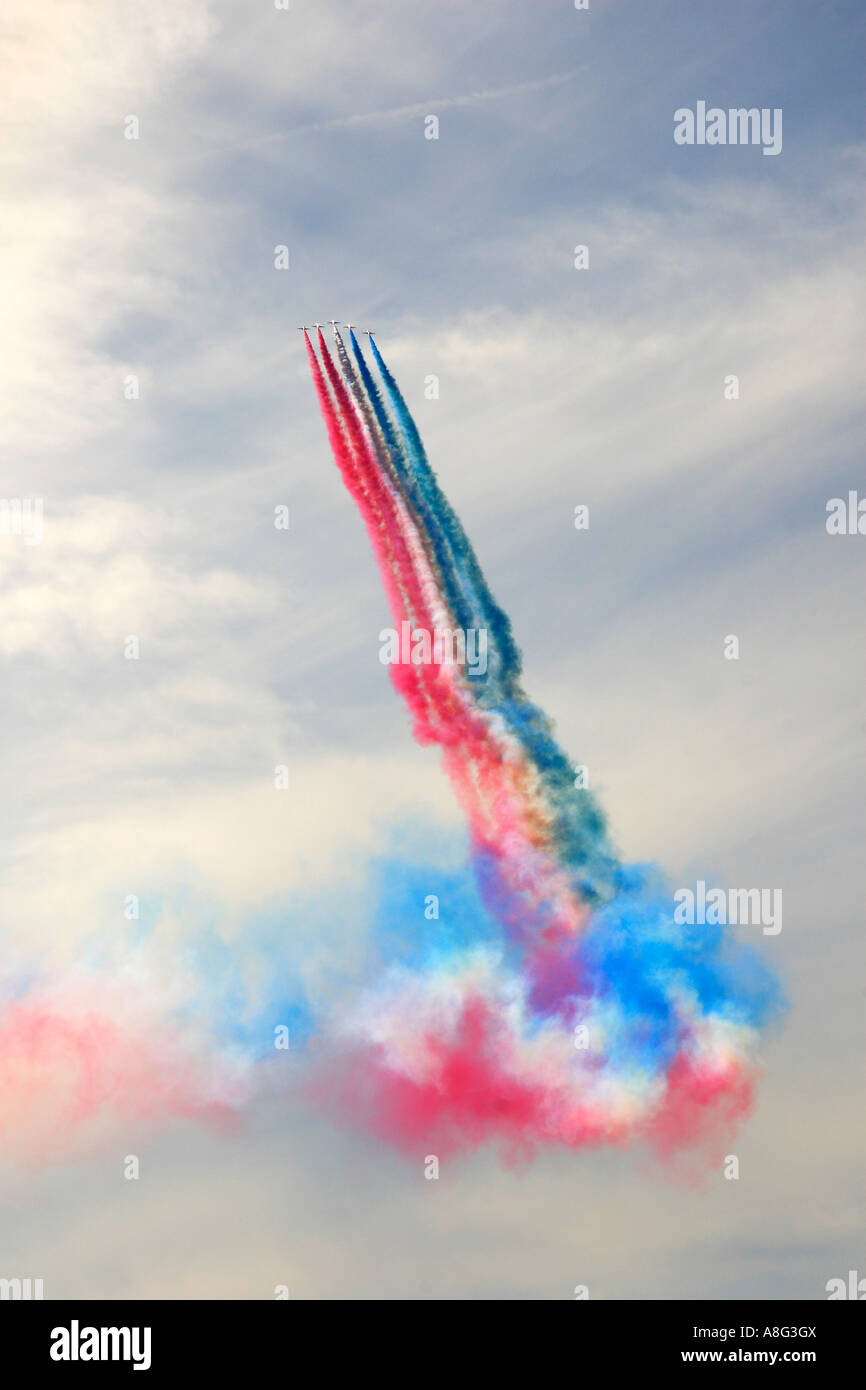 Red Arrows trailing red white blue smoke climbing vertically over St ...