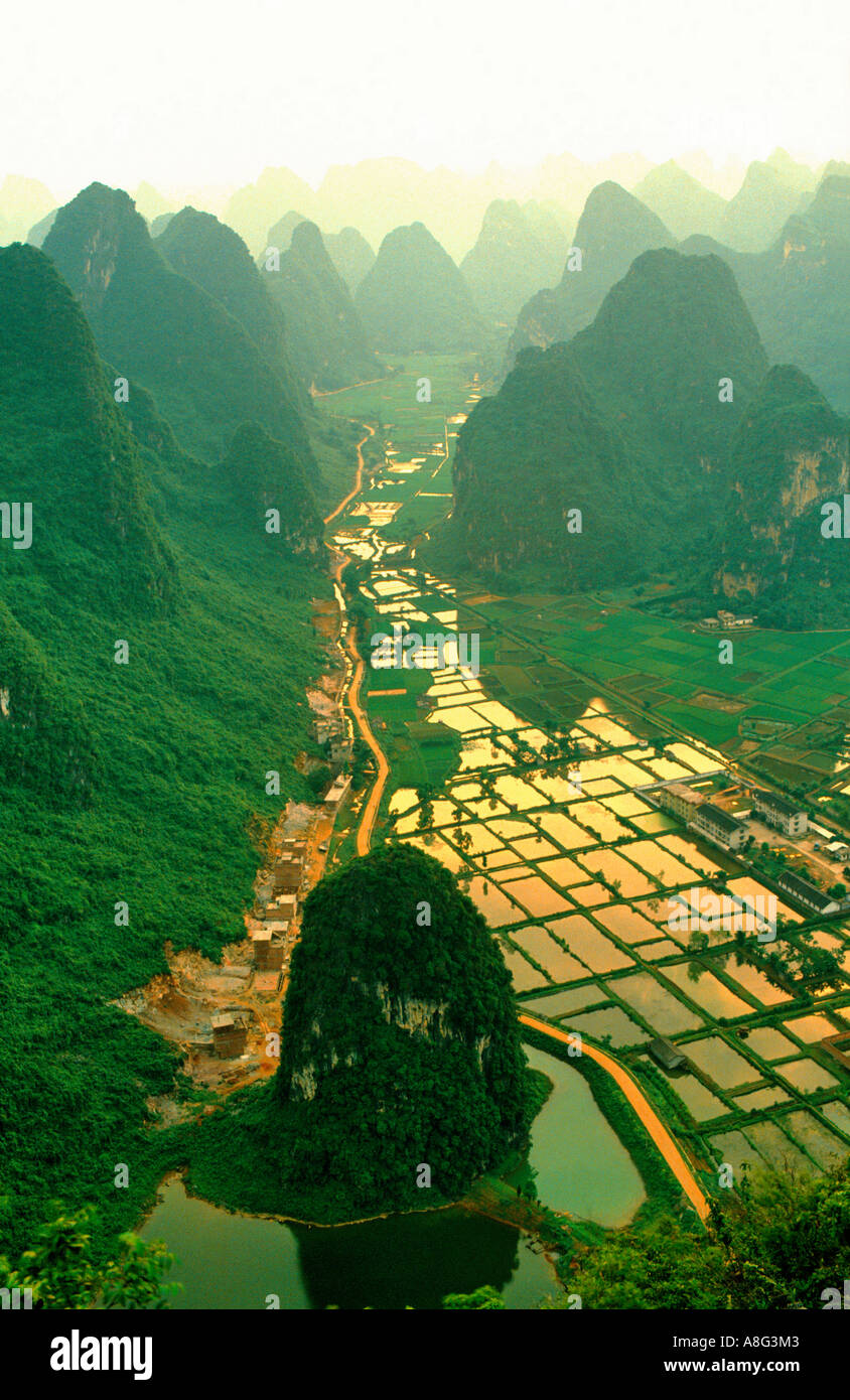 rice fields between mountain peaks, Yangshuo, China Stock Photo - Alamy