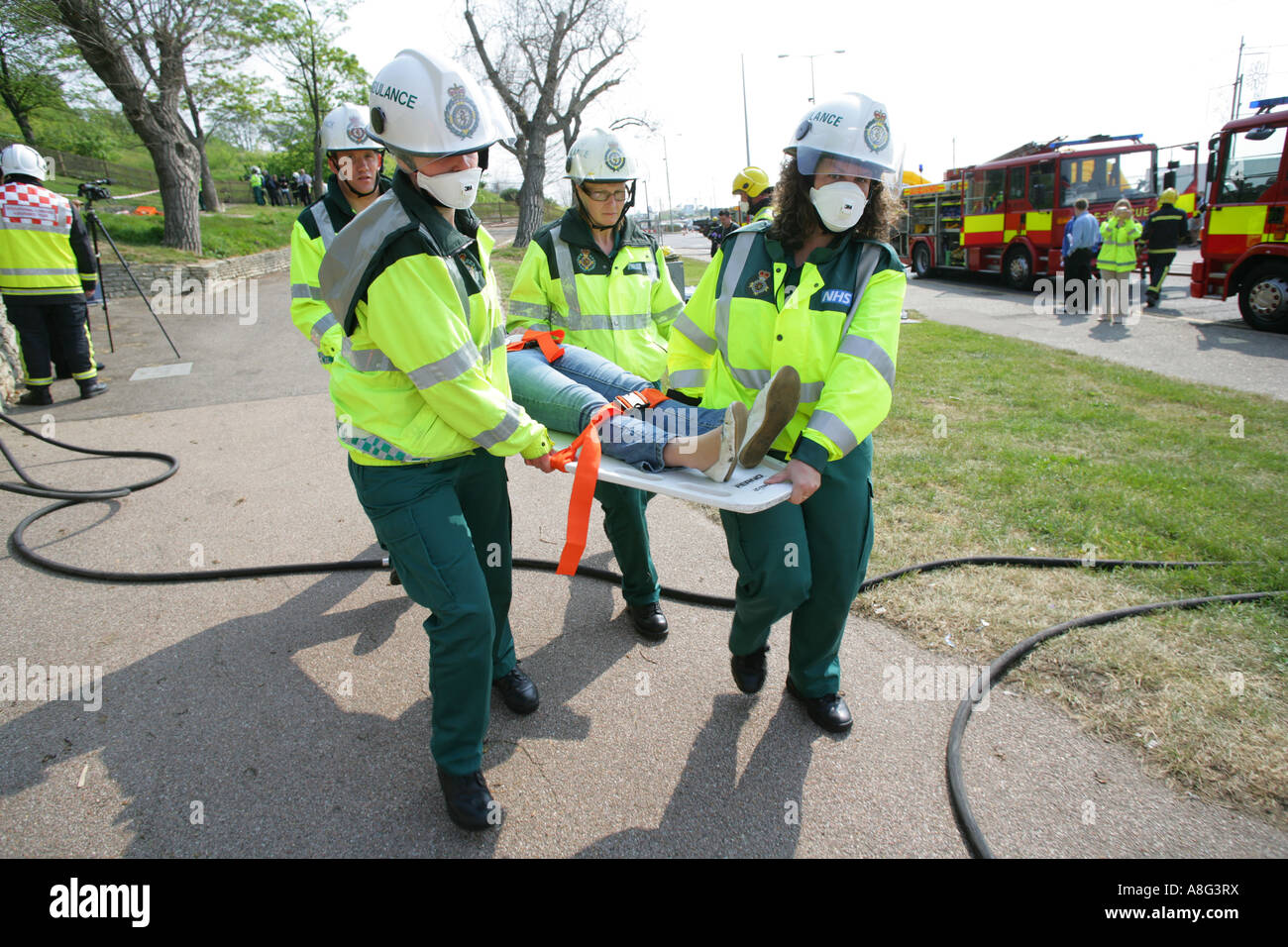 Ambulance paramedics taking part in a simulated aircrash exercise to ...