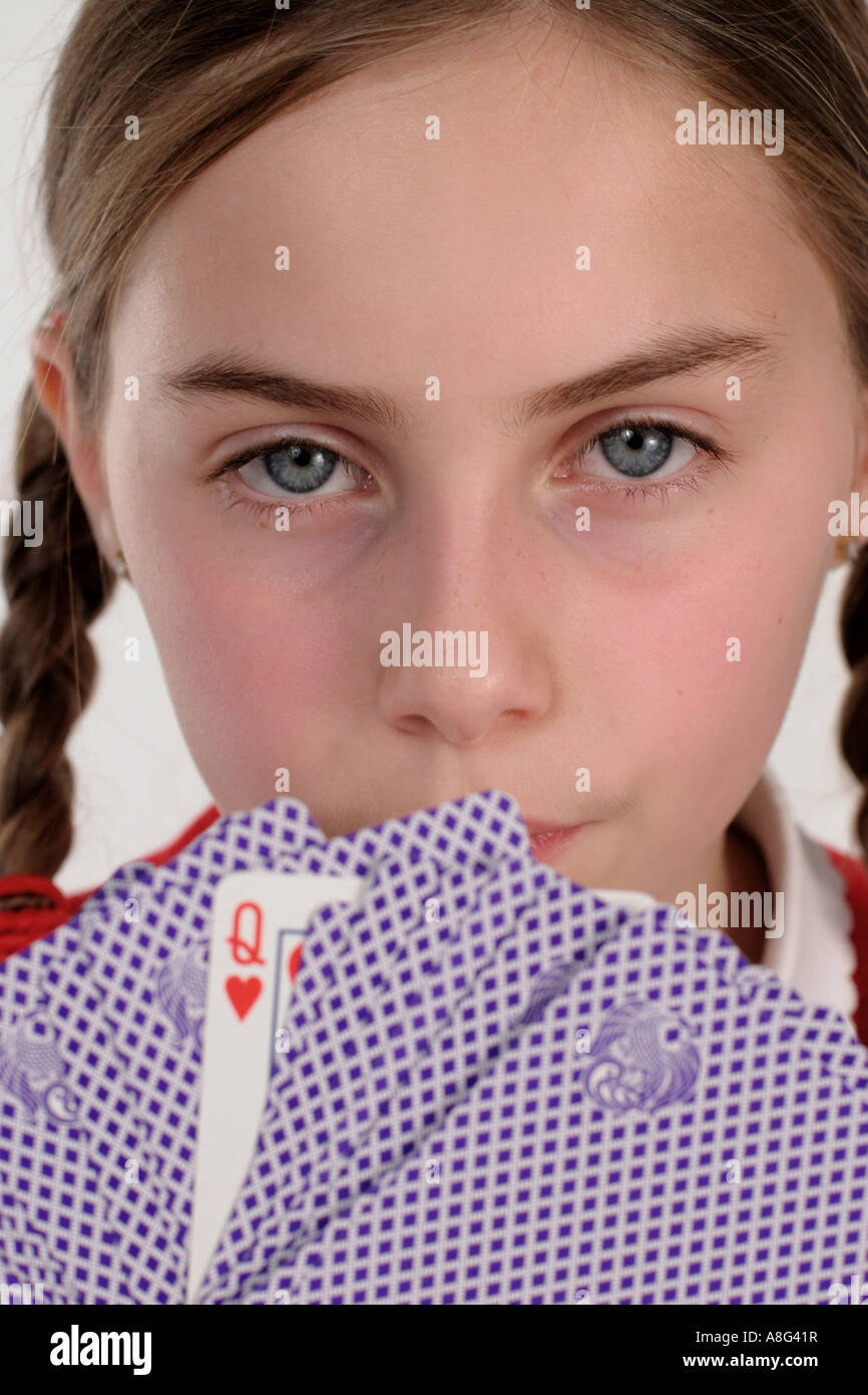 School girl holding playing cards Stock Photo - Alamy