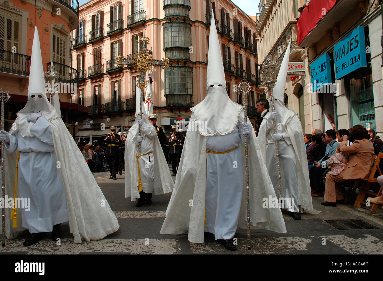 White hooded men in Easter Sunday procession, Malaga, Spain Stock Photo ...