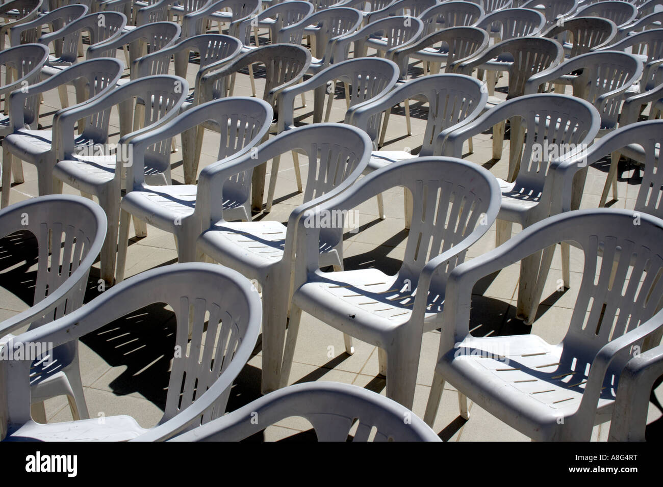 pattern of white plastic chairs at an outside theatre at Rash Al ...