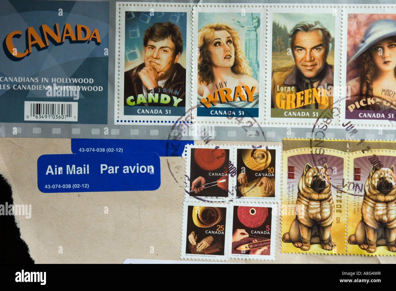 Envelope with air mail stickers and Canadian stamps including stamps of ...