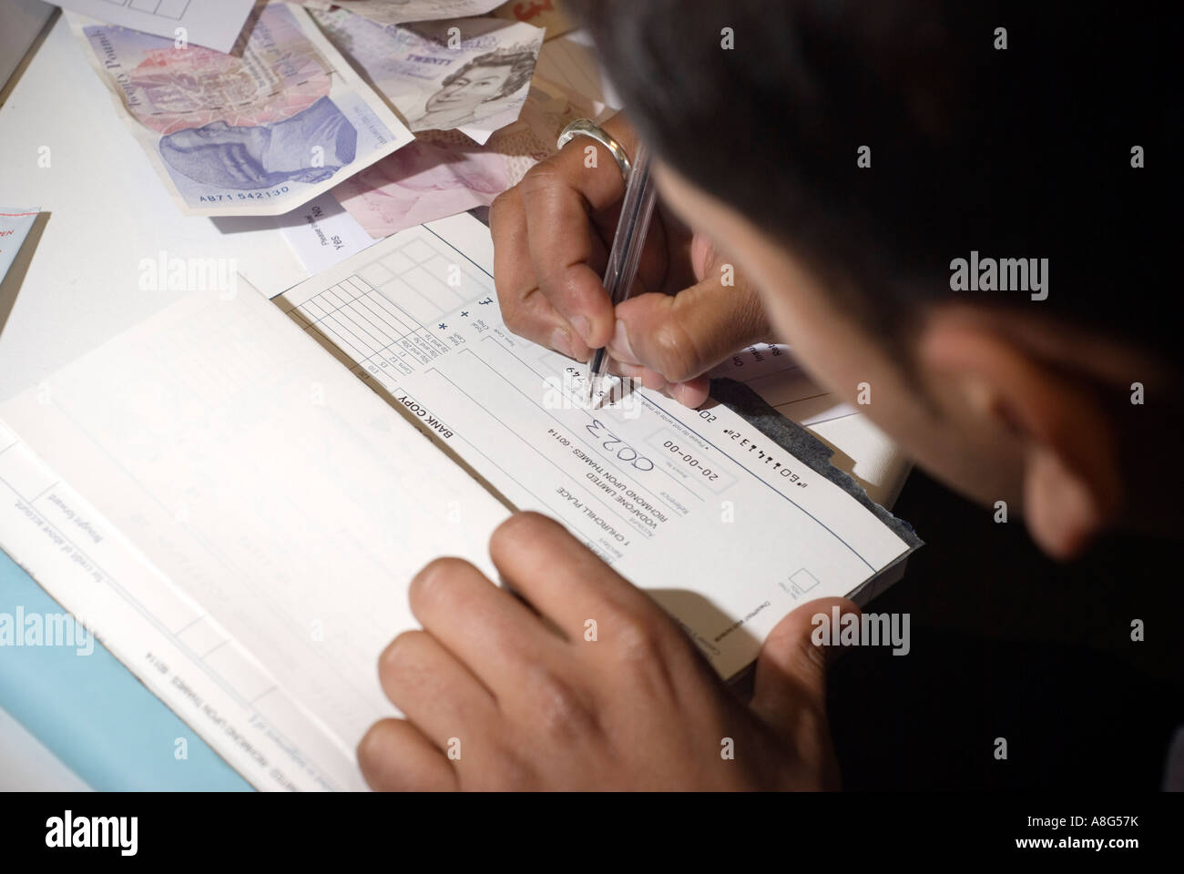 Paying in cheque hi-res stock photography and images - Alamy