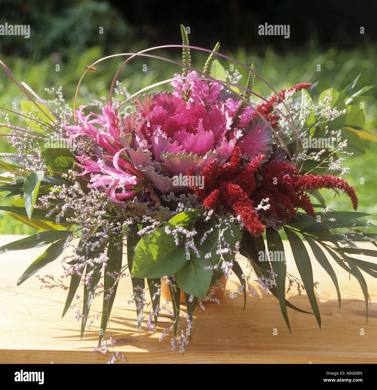 bouquet with ornamental cabbage , foxtail grass , nerine and statice ...