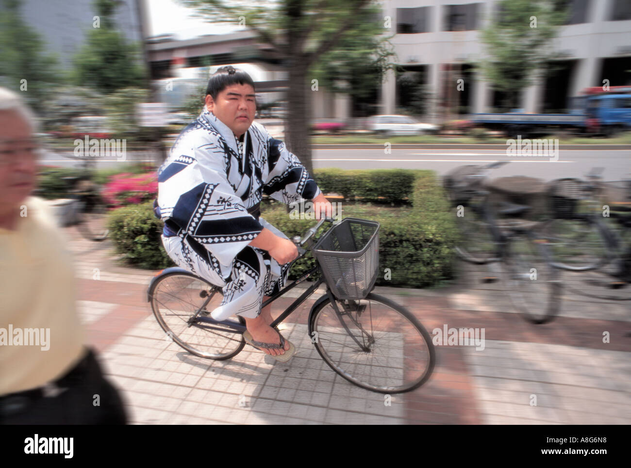 sumo wrestler on bicycle, Tokyo, Japan Stock Photo - Alamy