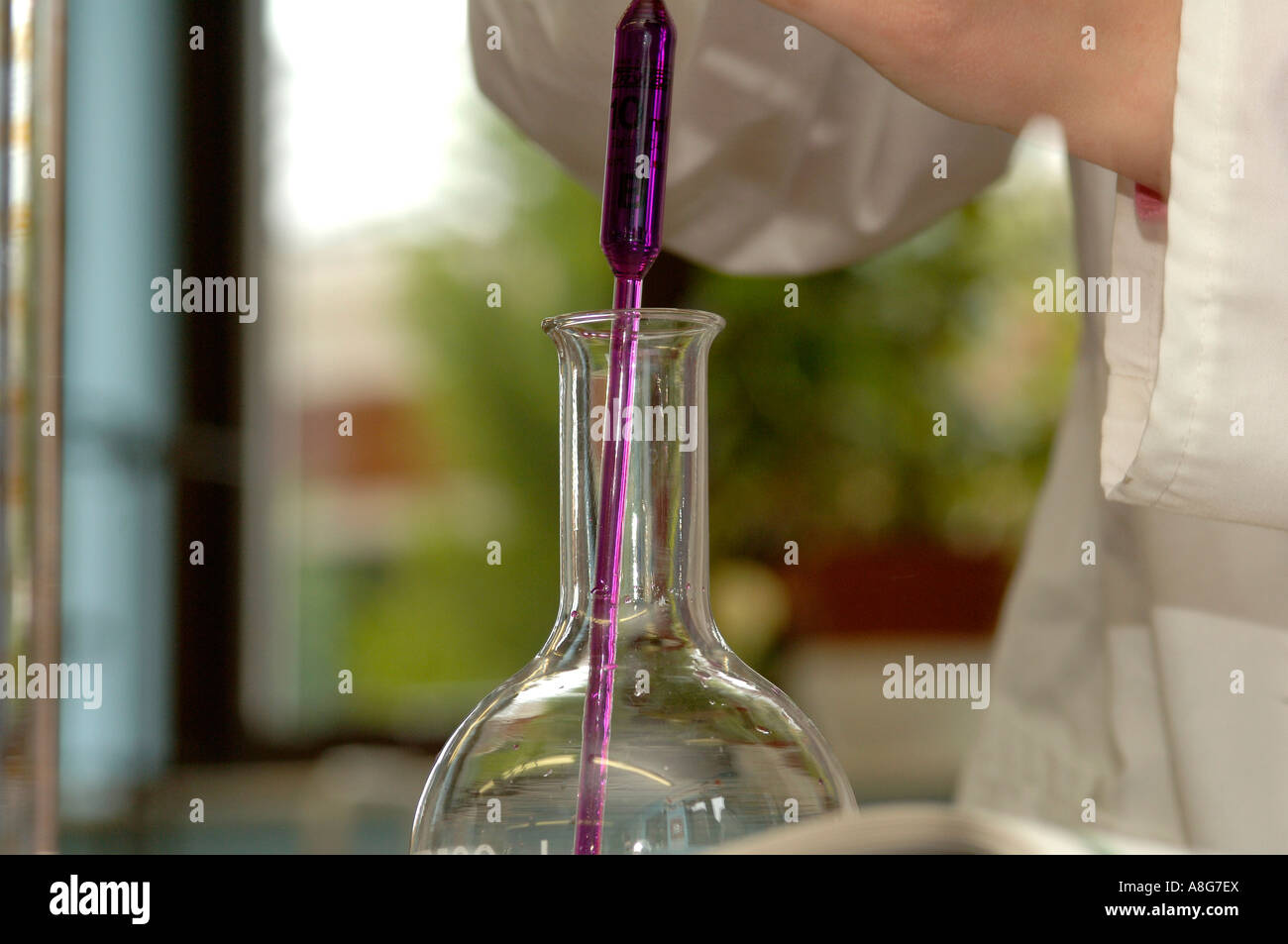 An A level student gets down to a chemistry experiment Stock Photo - Alamy