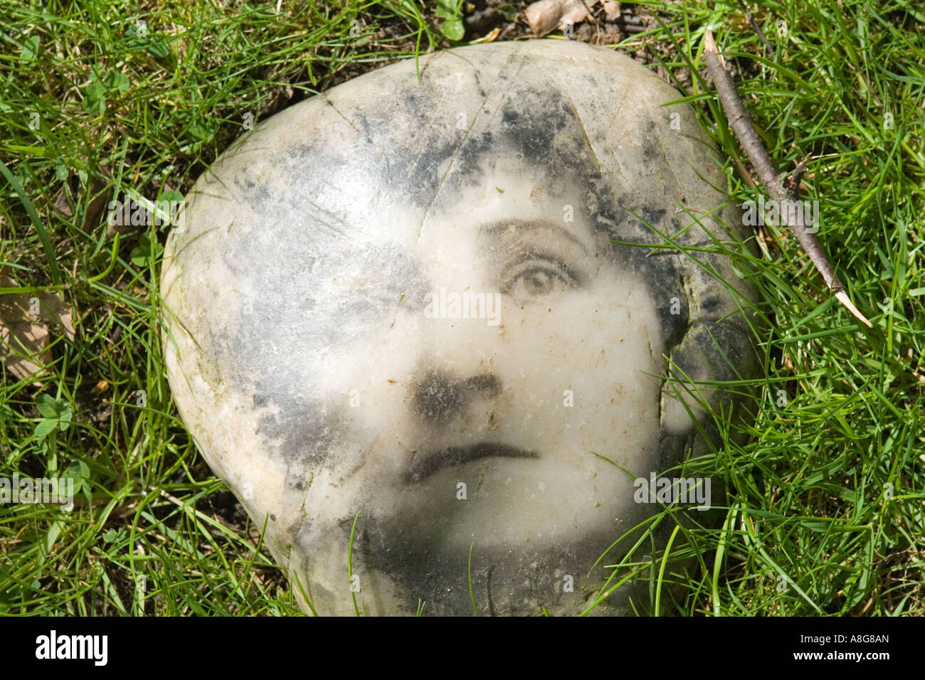 Printed stone face Stock Photo - Alamy