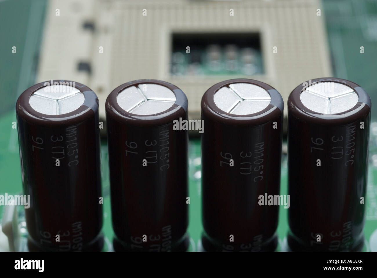 Capacitors on a computer motherboard Stock Photo - Alamy