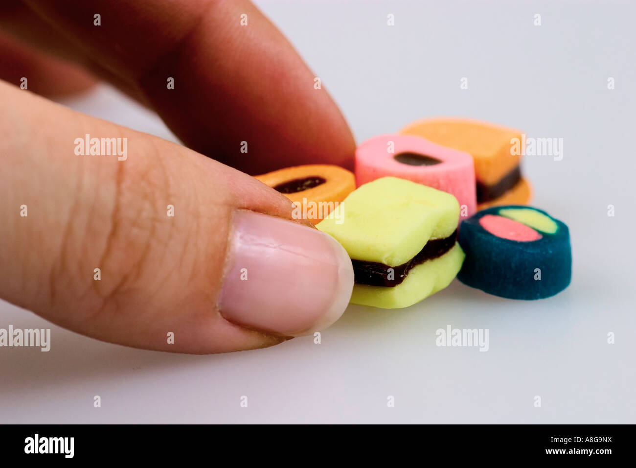 Hand with candy Stock Photo - Alamy