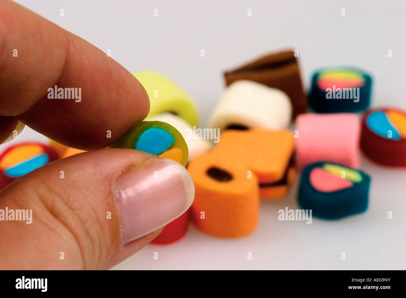 Hand with candy Stock Photo - Alamy