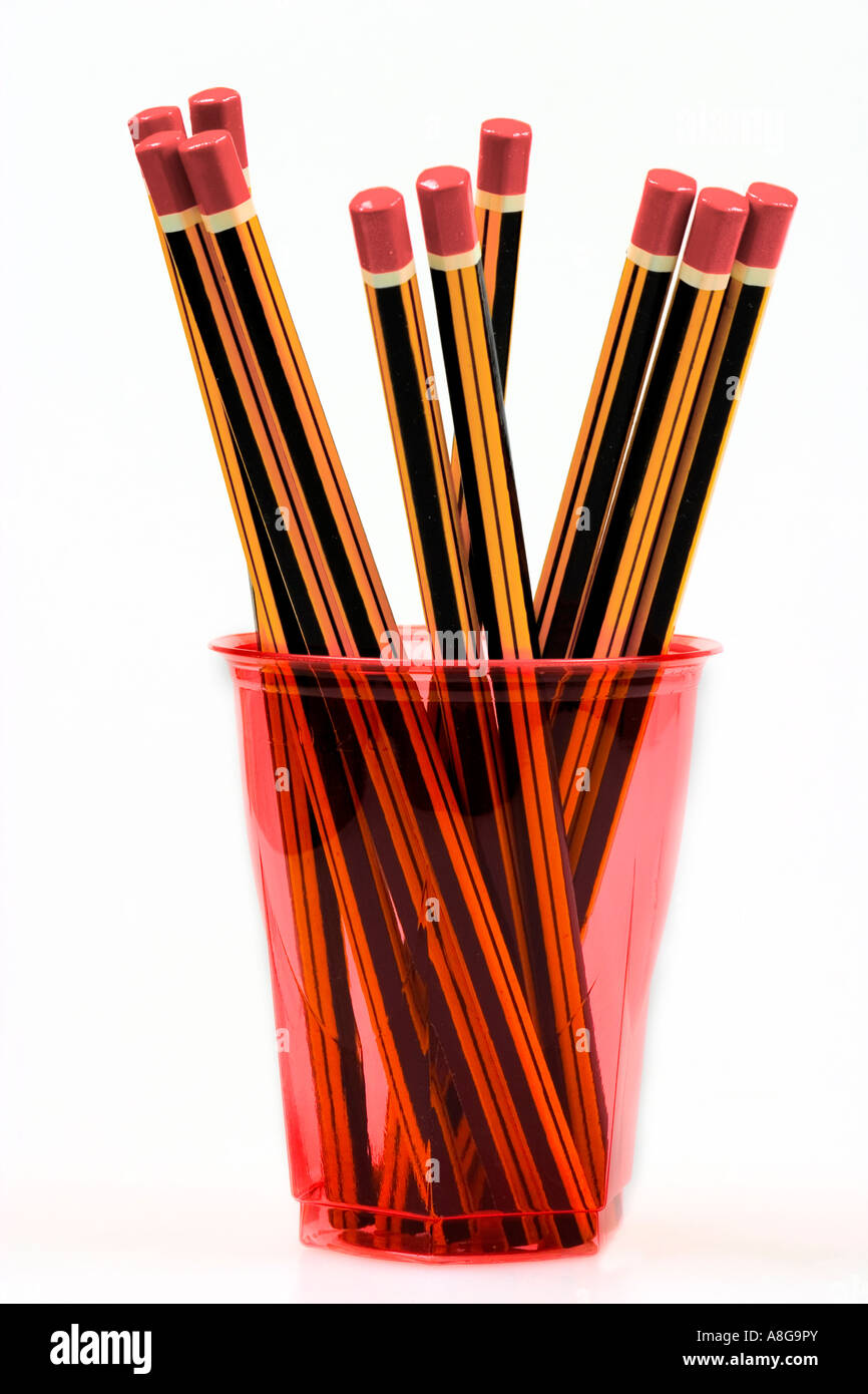 Pencils in a red glass Stock Photo - Alamy