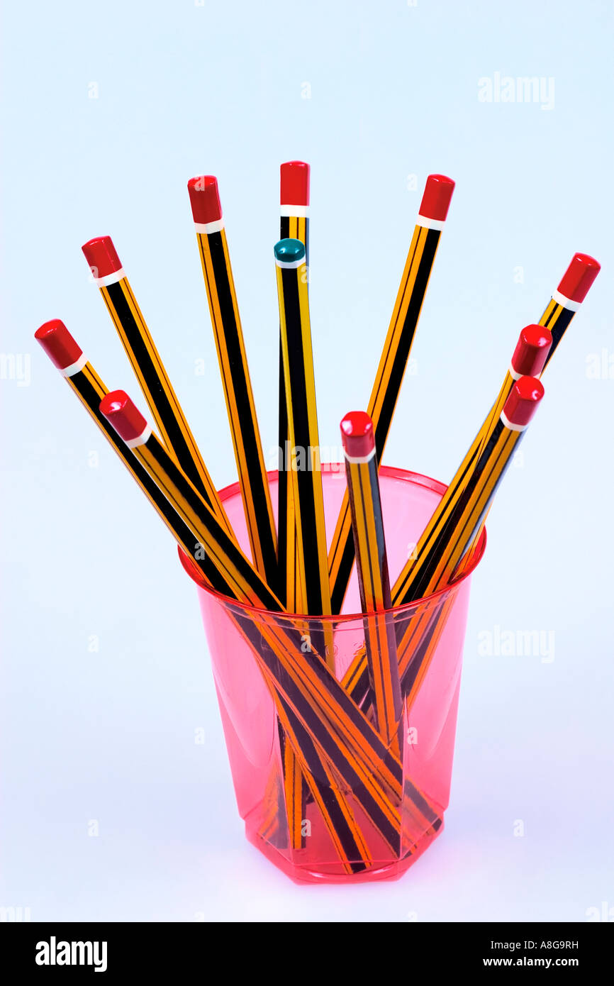 Pencils in a red glass Stock Photo - Alamy