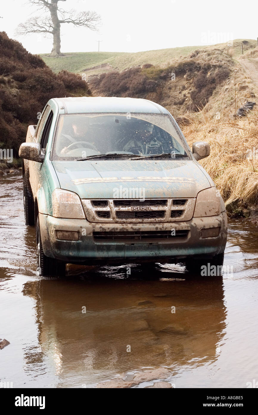 4x4 off road driving through water Stock Photo - Alamy