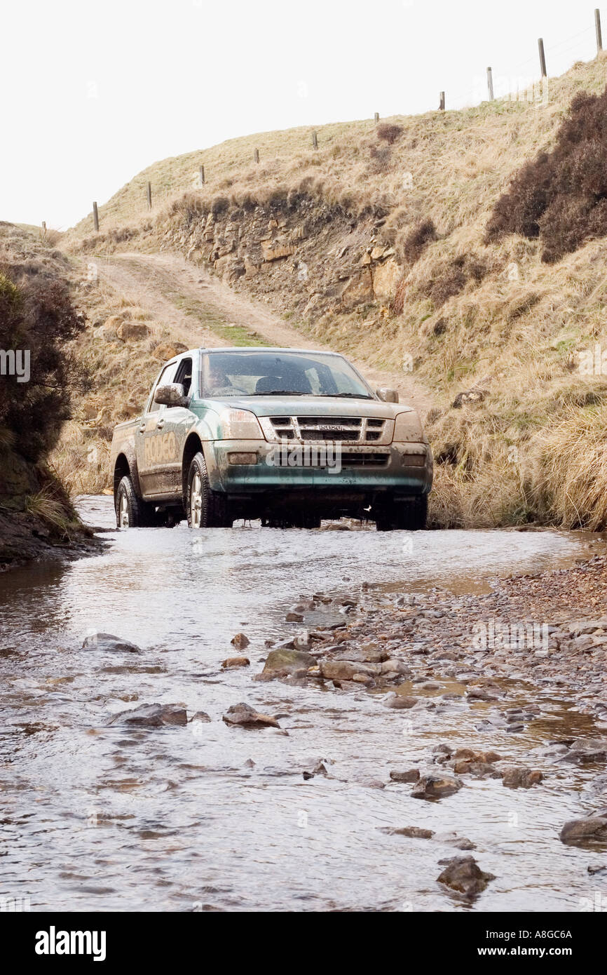 4x4 off road driving through water Stock Photo - Alamy
