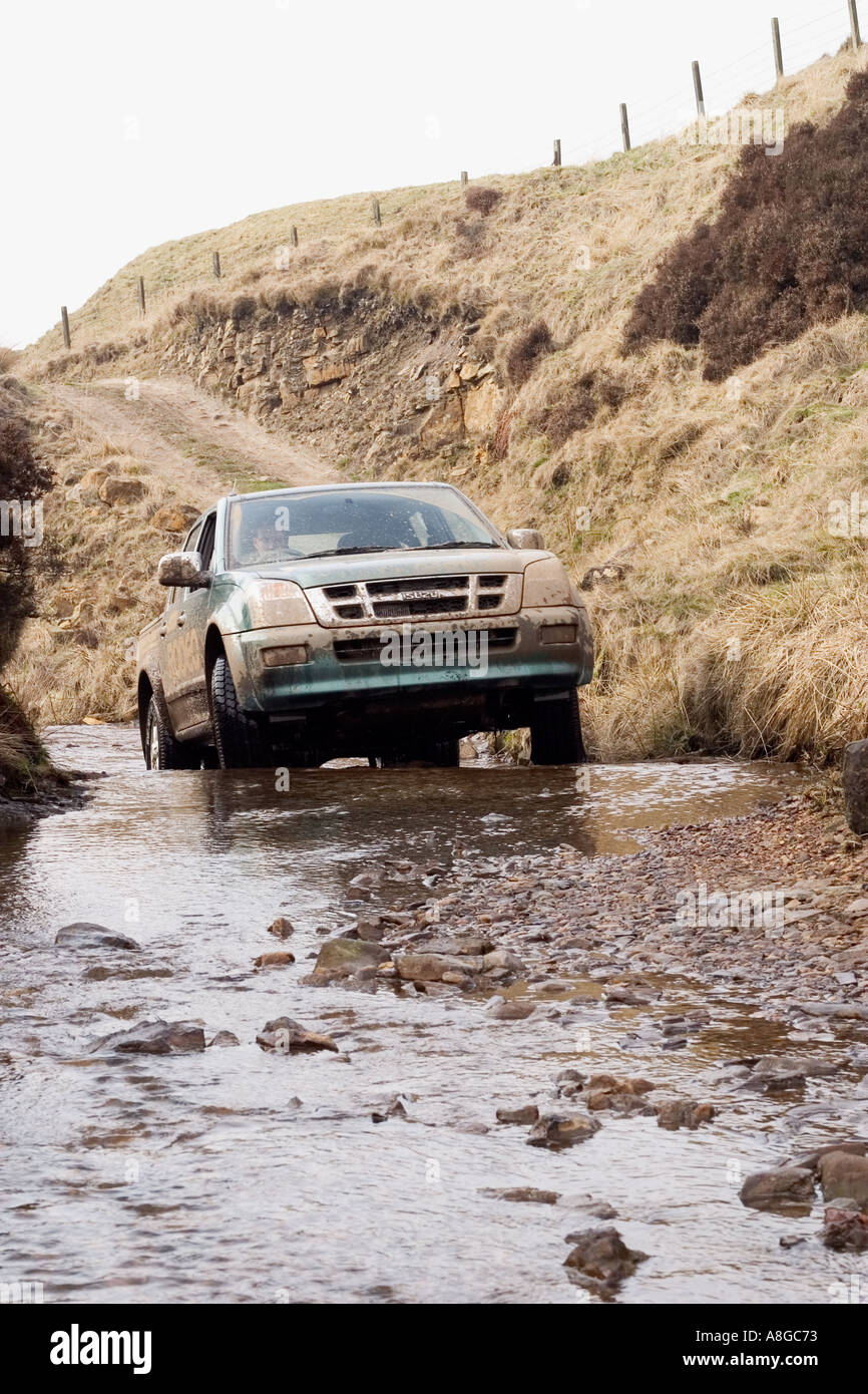 4x4 off road driving through water Stock Photo - Alamy