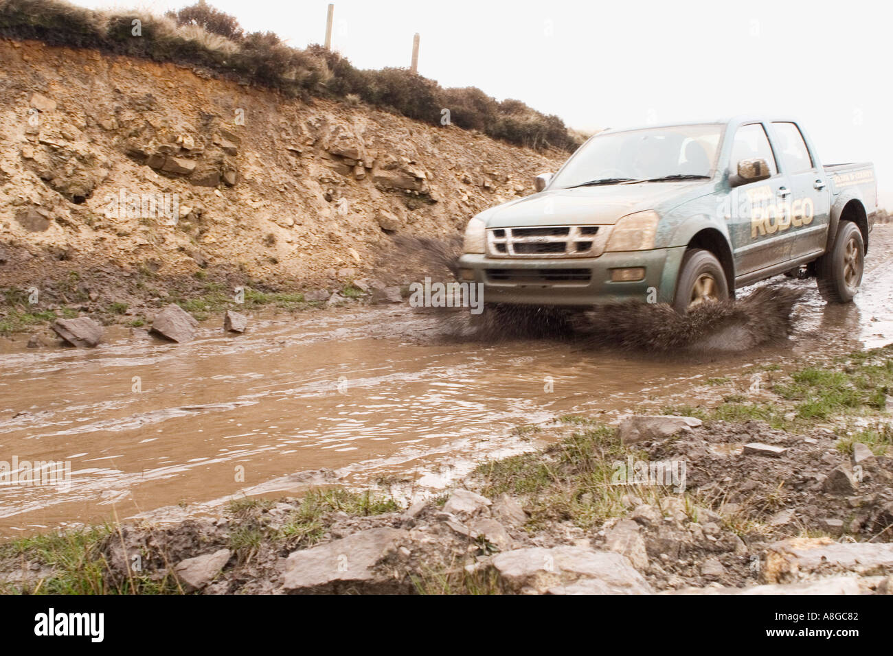 4x4 off road driving through water Stock Photo - Alamy