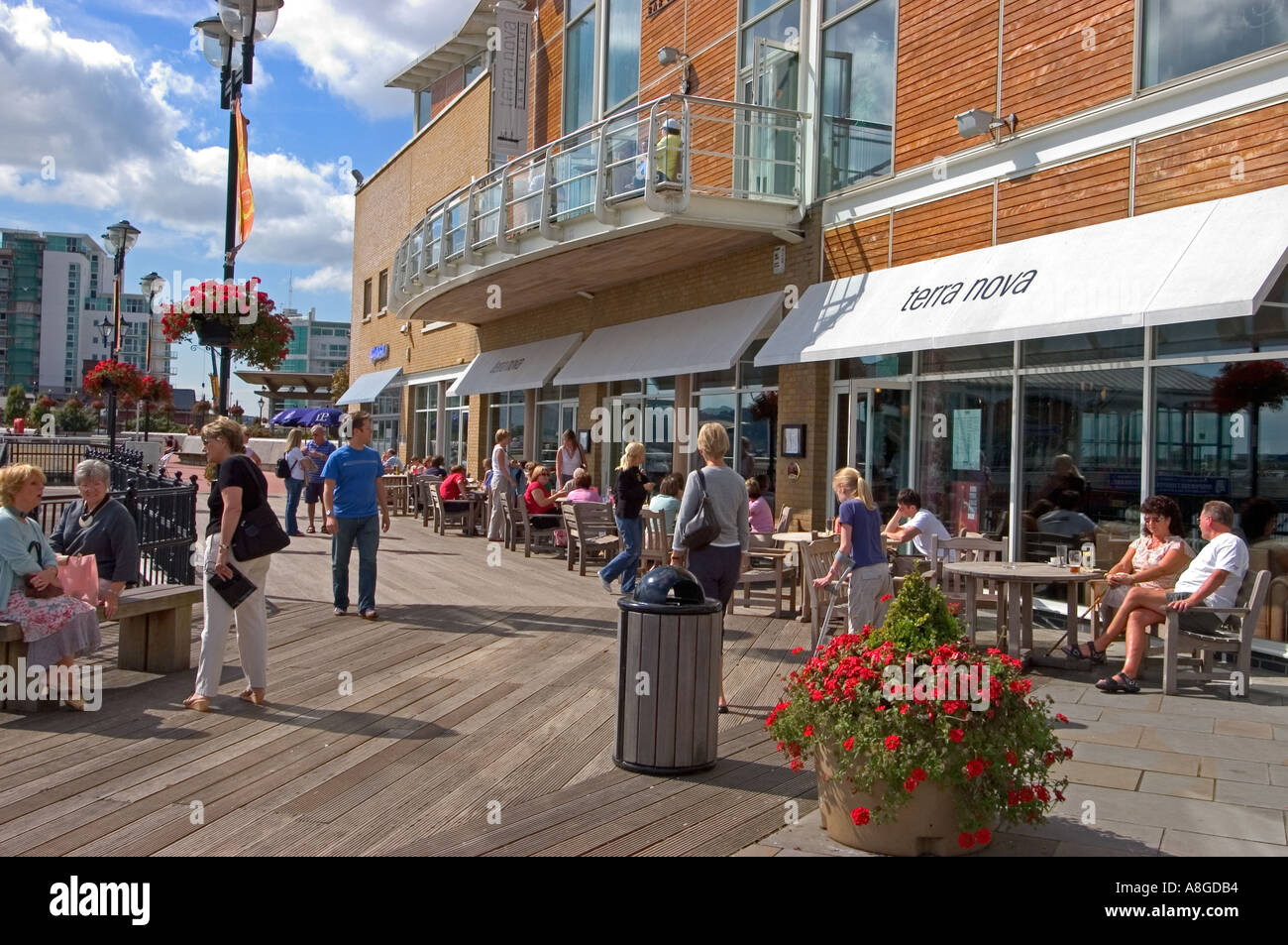 People sitting in Cafes in Cardiff Bay, Wales, UK Stock Photo - Alamy