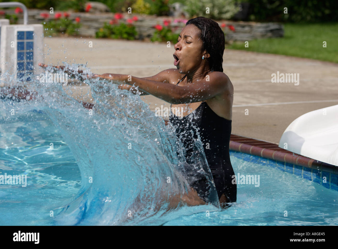 Woman splash pool african hi-res stock photography and images - Alamy