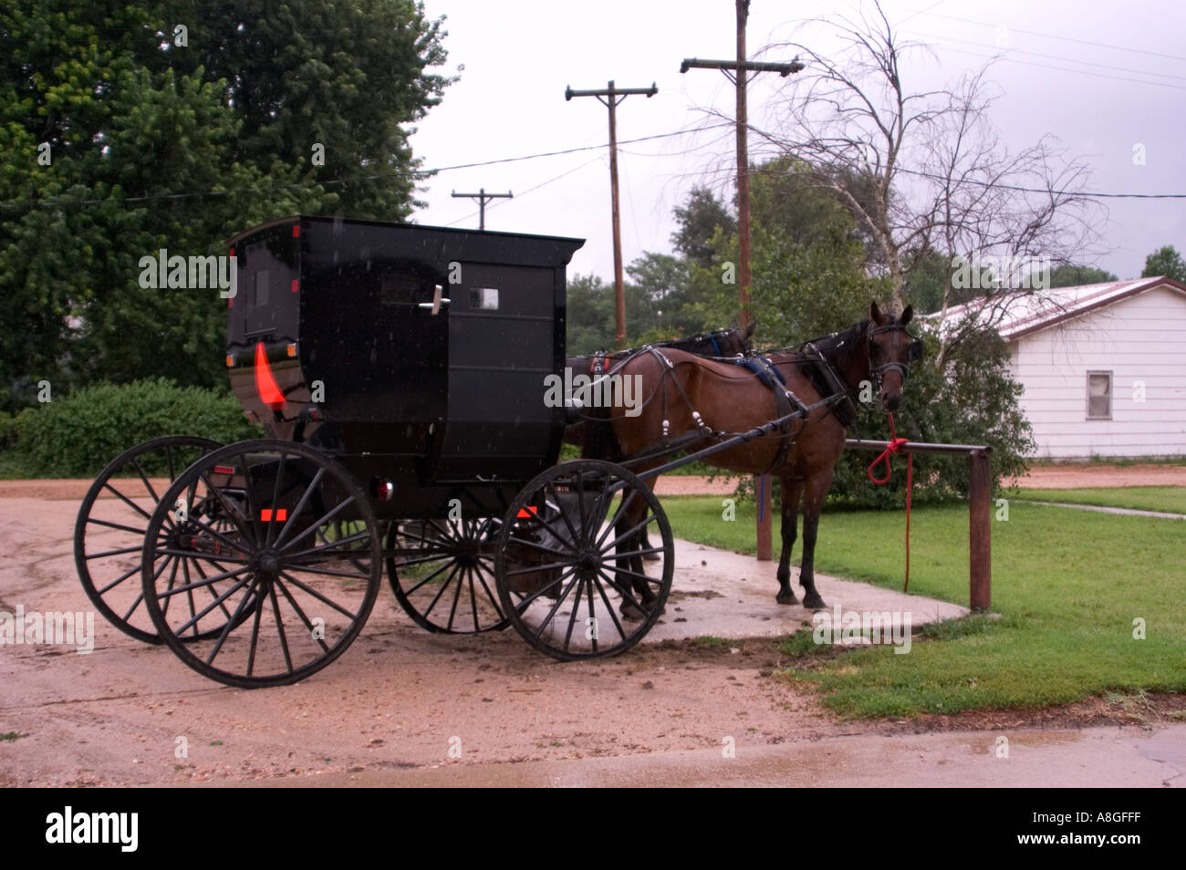 Amish Carriage in Rain Tied to Hitching Post Yoder Kansas Stock Photo ...