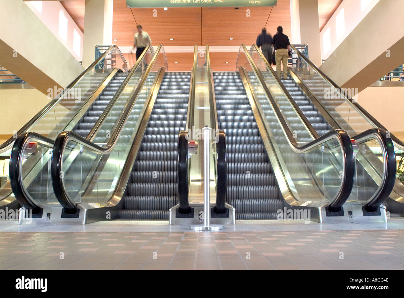 Escalator at airport terminal Stock Photo - Alamy