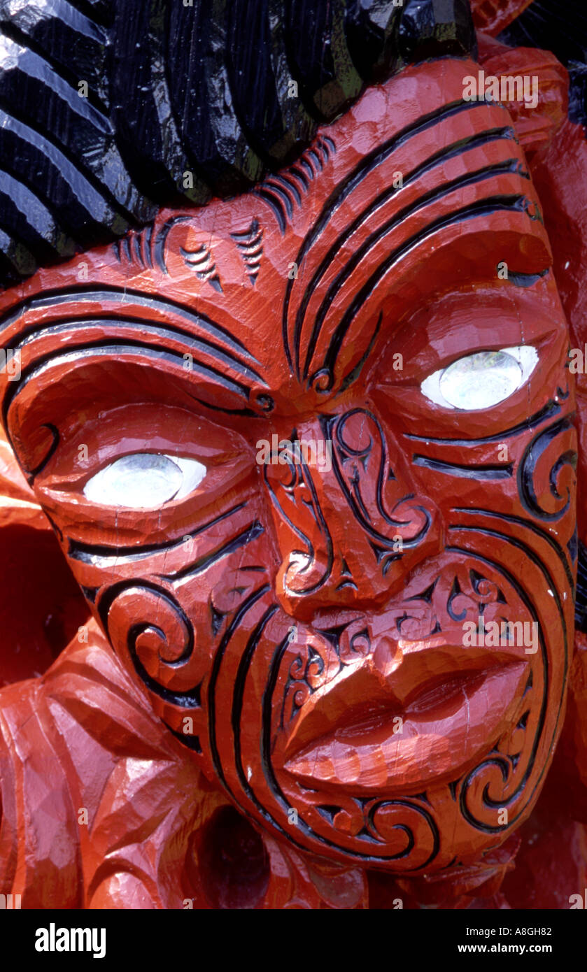 Traditional Maori carving depicting warriors face and facial moko ...