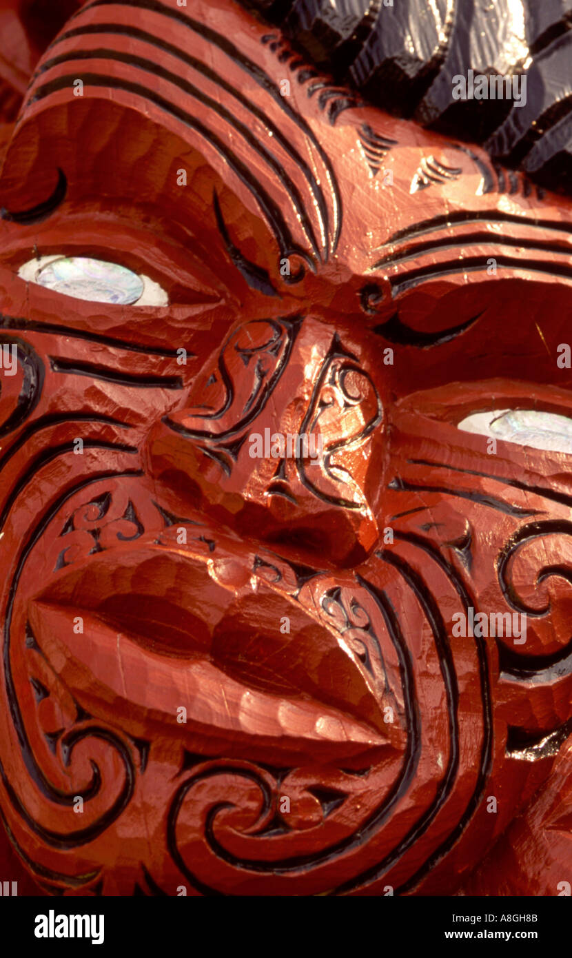 Traditional Maori carving depicting warriors face and facial moko ...