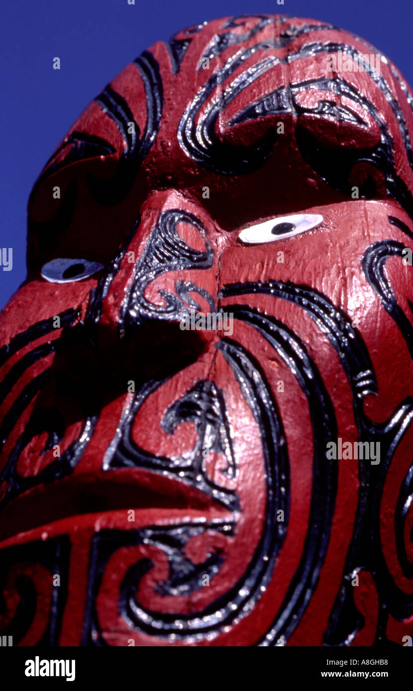 Traditional Maori carving depicting warriors face and facial moko ...