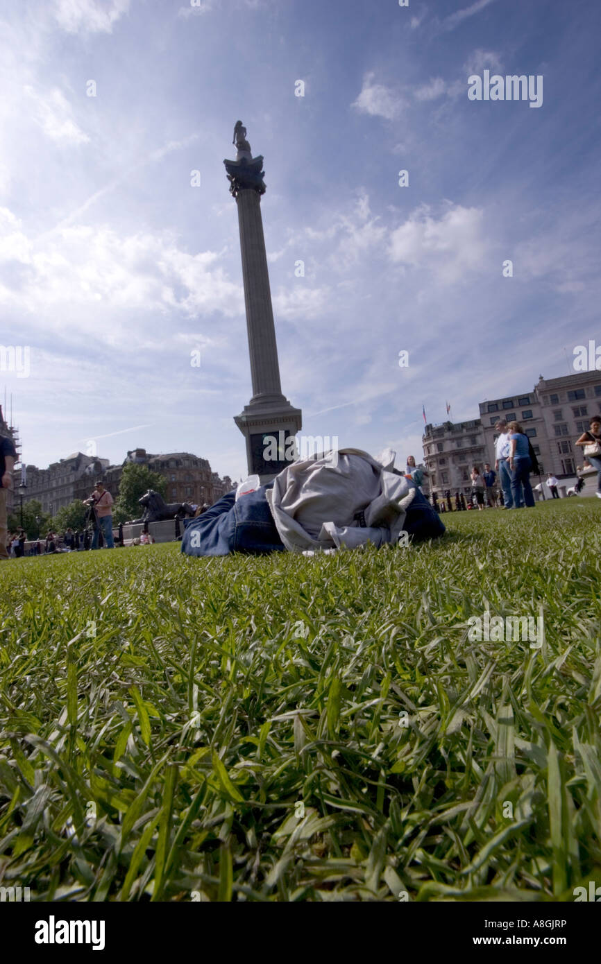 man relaxes in sun in Trafalgar Square transformed as a green space 2 ...