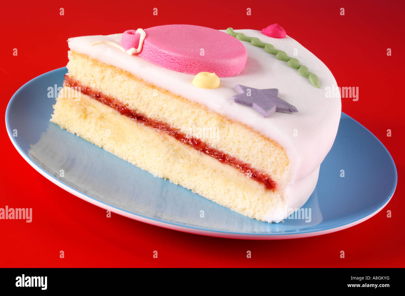 SLICE OF PARTY CAKE Stock Photo - Alamy