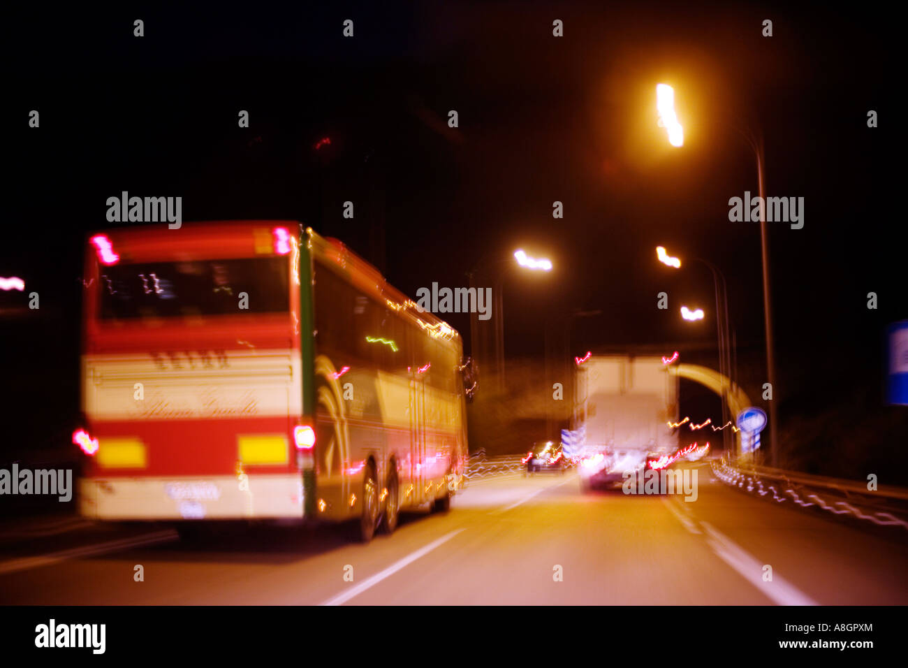bus of passengers circulating around a railcar at night Stock Photo - Alamy