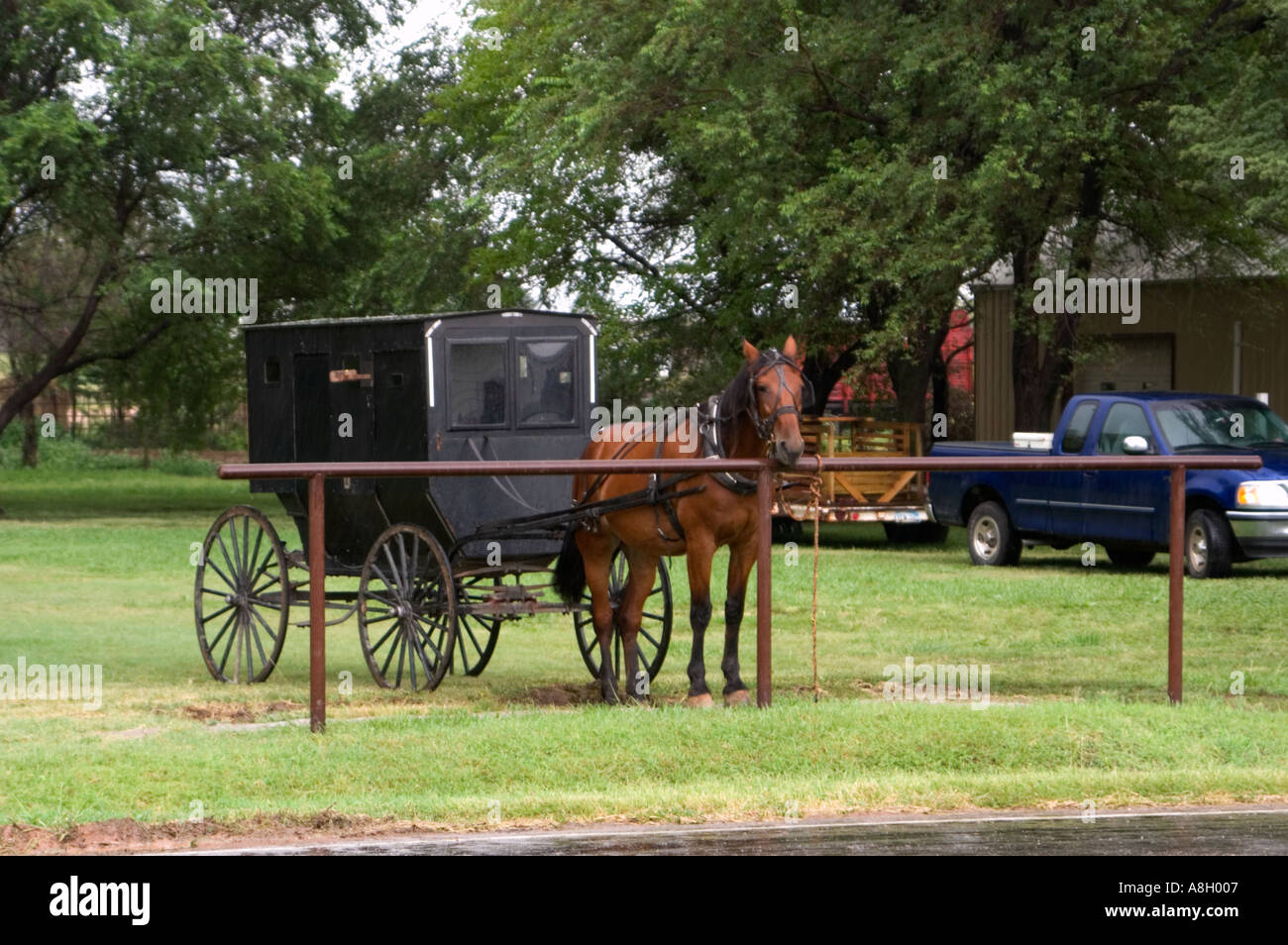 Amish Carriage in Rain Tied to Hitching Post Yoder Kansas Stock Photo ...