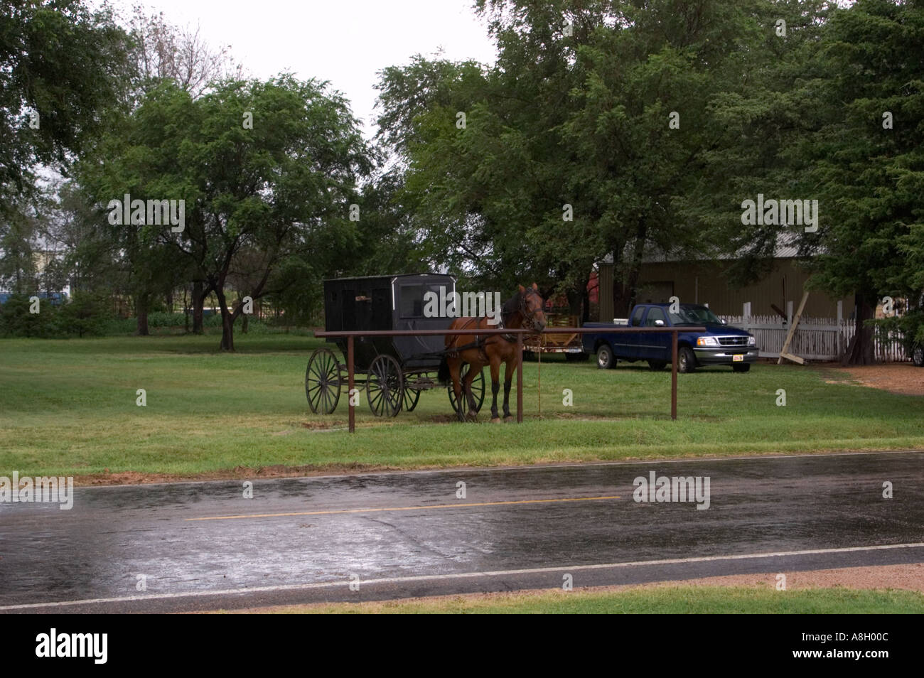 Amish Carriage in Rain Tied to Hitching Post Yoder Kansas Stock Photo ...