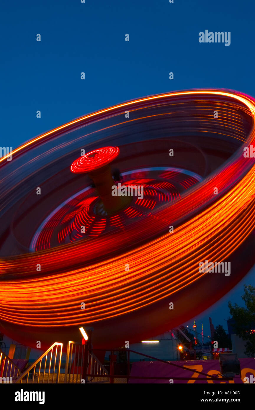 Carnival midway ride in motion Stock Photo - Alamy