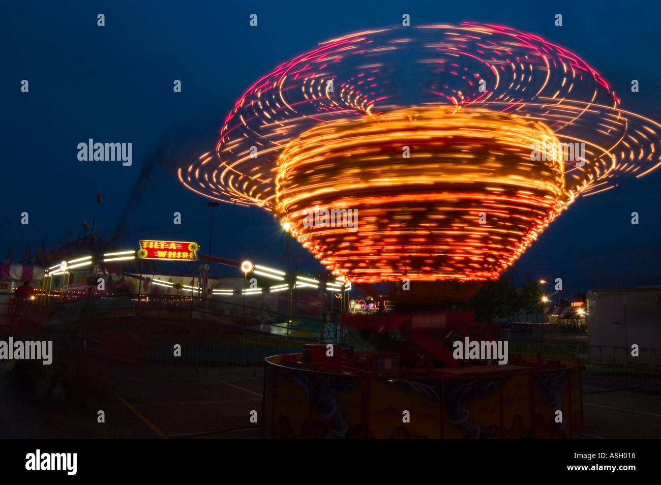 Carnival midway ride in motion Stock Photo - Alamy