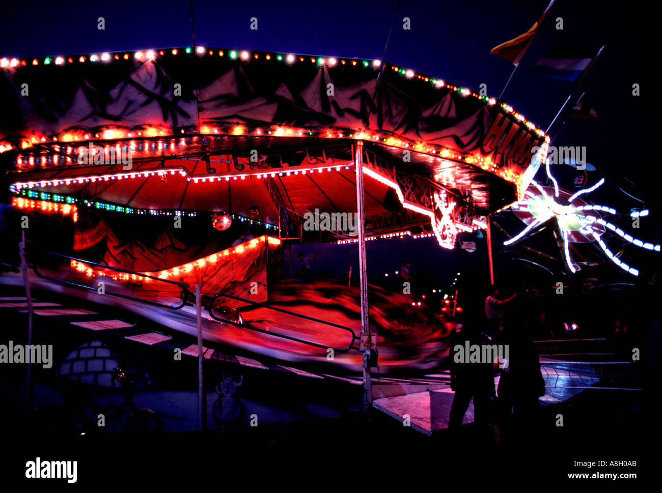 Night motion shot of carnival midway ride Stock Photo - Alamy