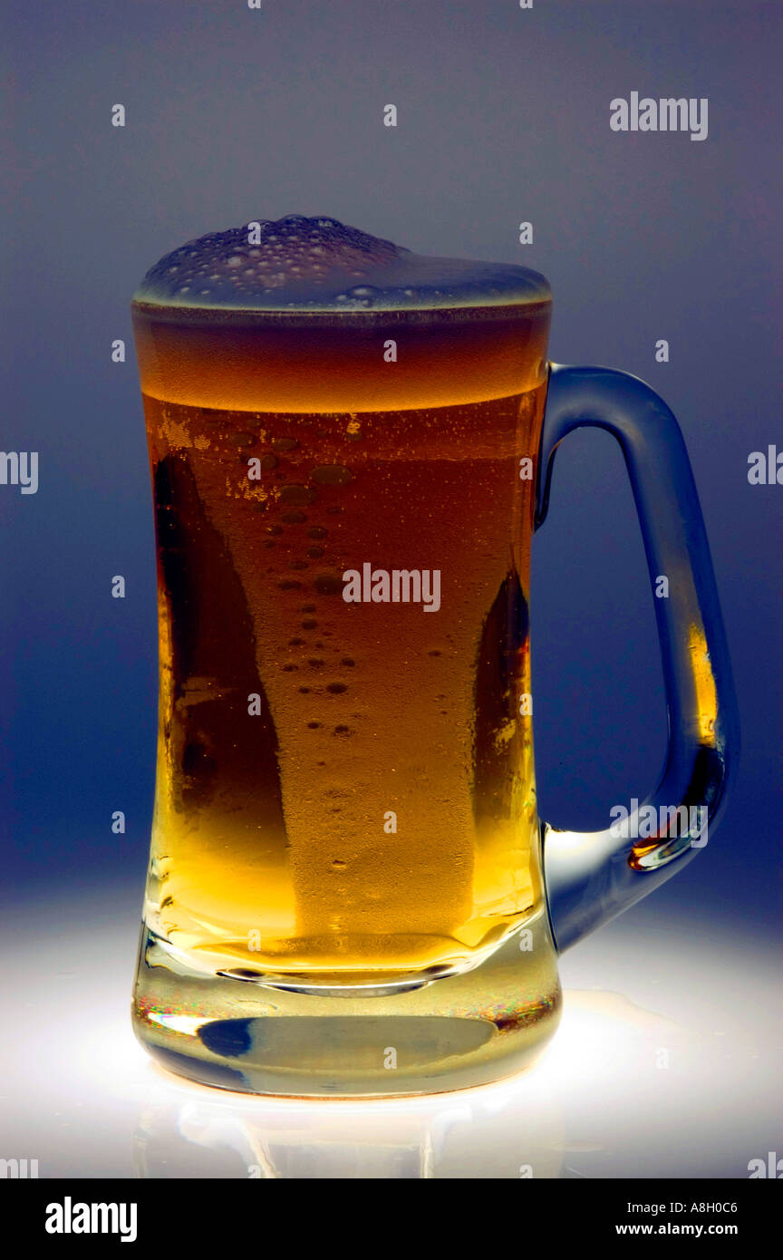 Bottom lit studio still life of overflowing beer mug Stock Photo - Alamy