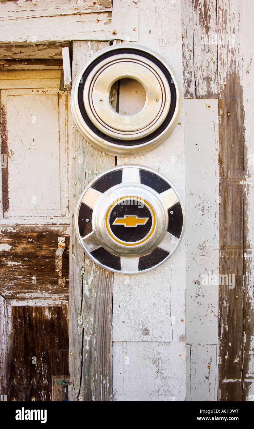 Two old hubcaps nailed to a weathered wood wall. Rural Missouri, USA ...
