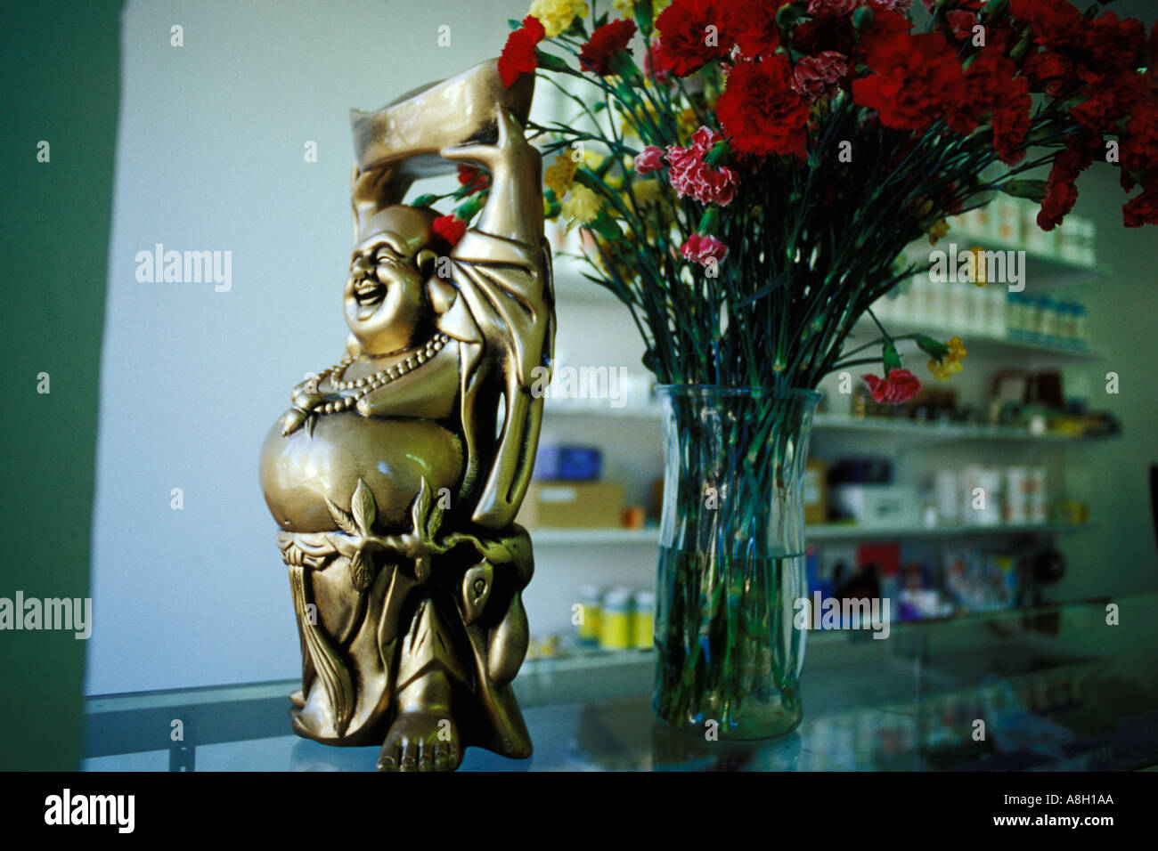 Buddha statue in shop Stock Photo - Alamy