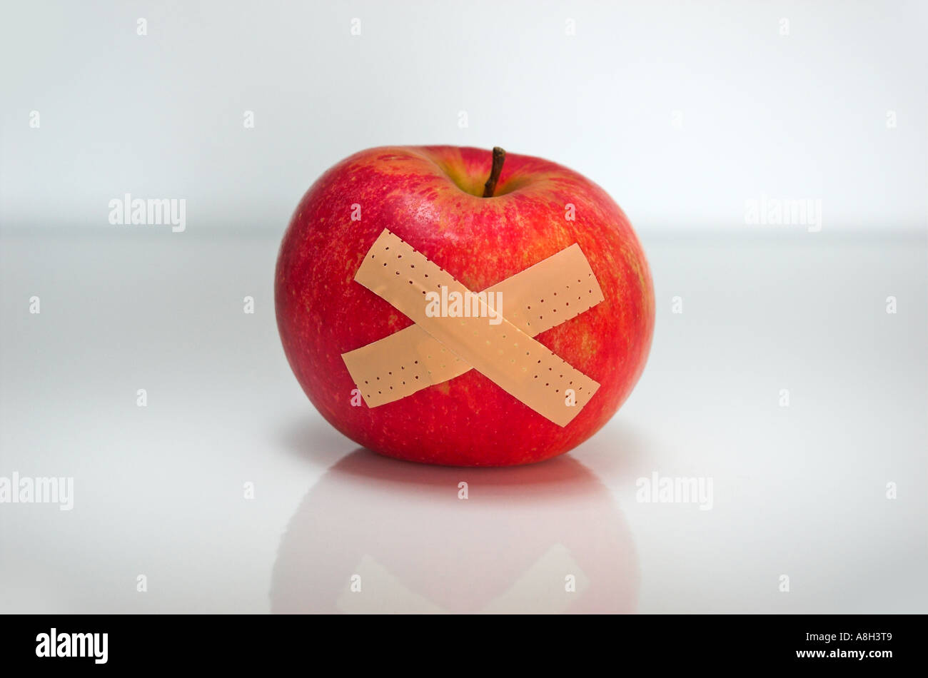 Red Apple with Plaster Stock Photo - Alamy