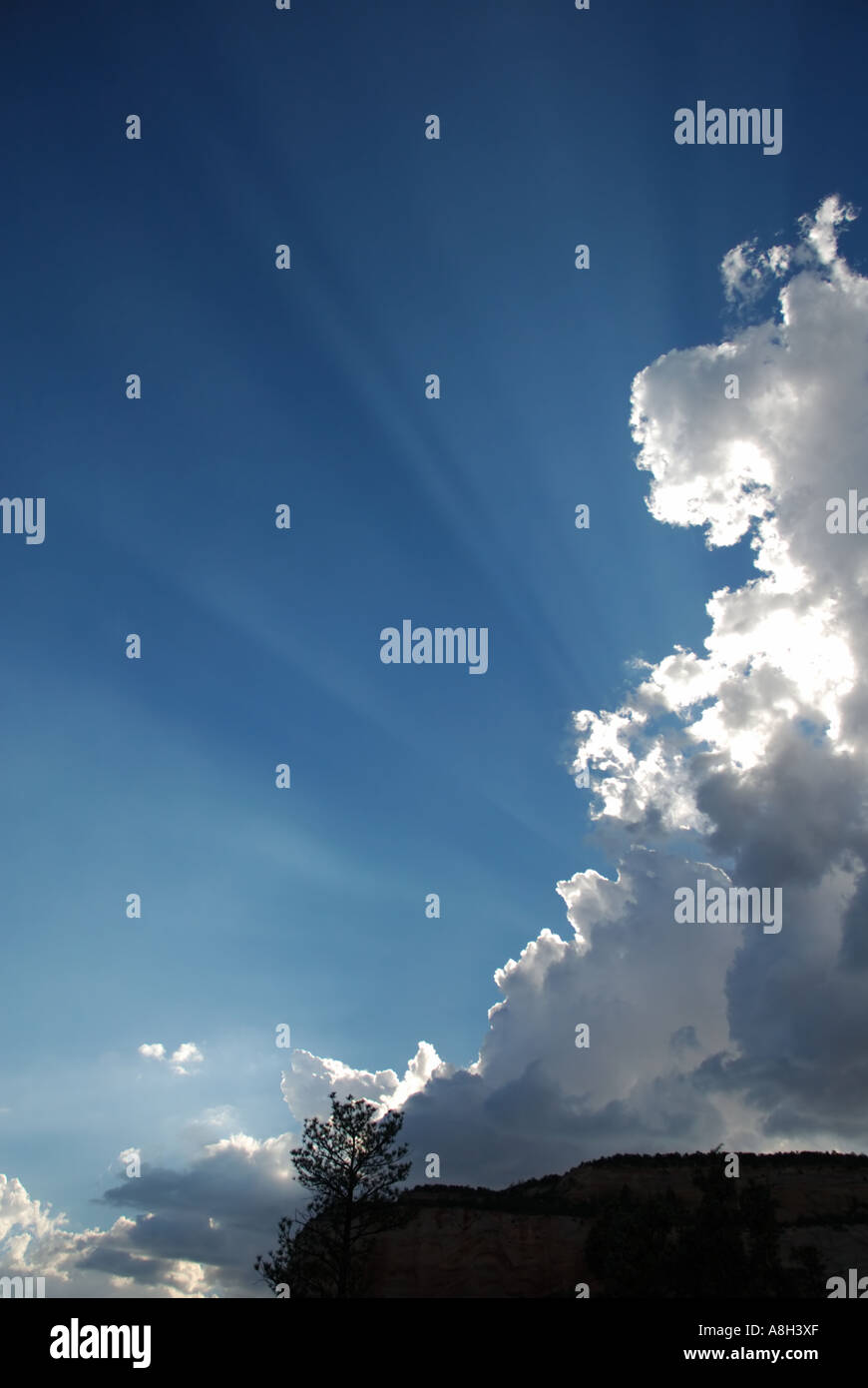 Sun Rays from Behind Clouds Stock Photo - Alamy